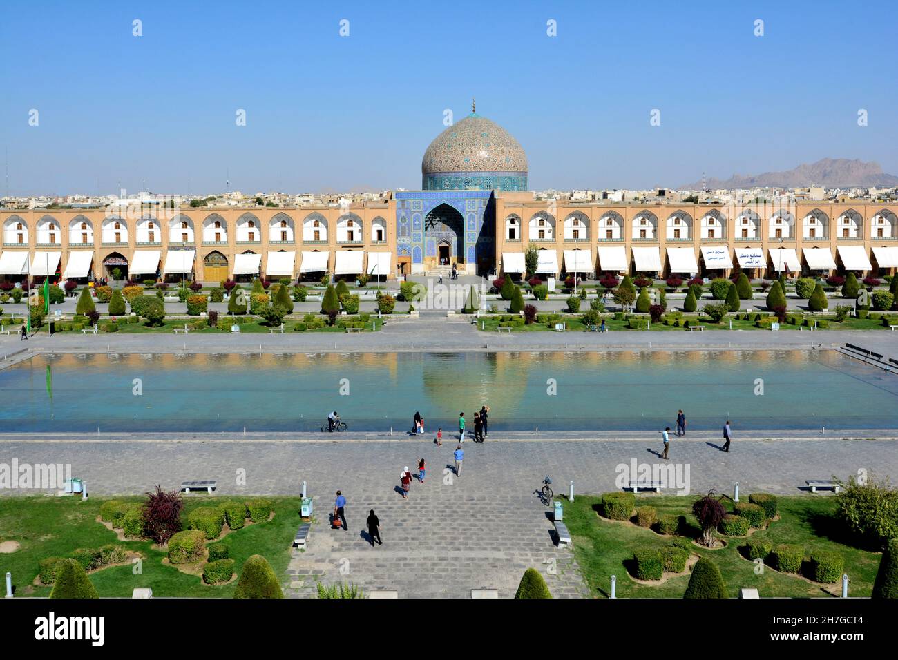 IRAN. ISPAHAN ESFAHAN. KIDS RIDING BICYCLE ON EMAM SQUARE, PART OF THE ...