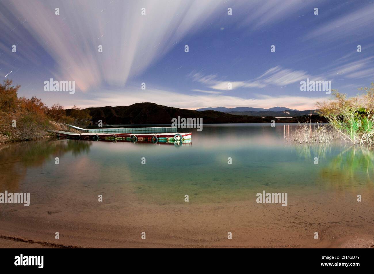 Night photography, on the jetty and the calm waters of a swamp Stock ...