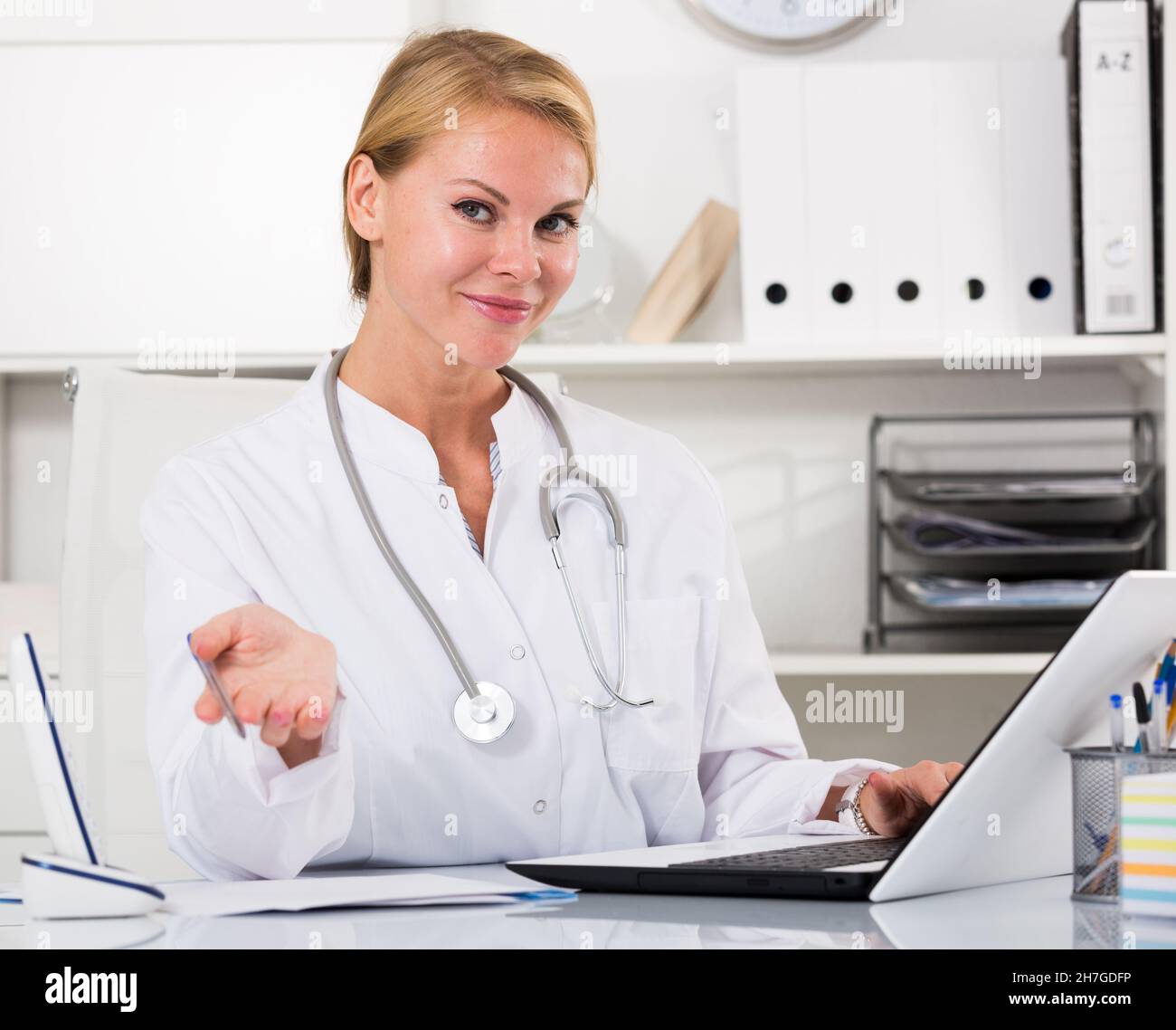 young female doctor working on computer in home office Stock Photo - Alamy