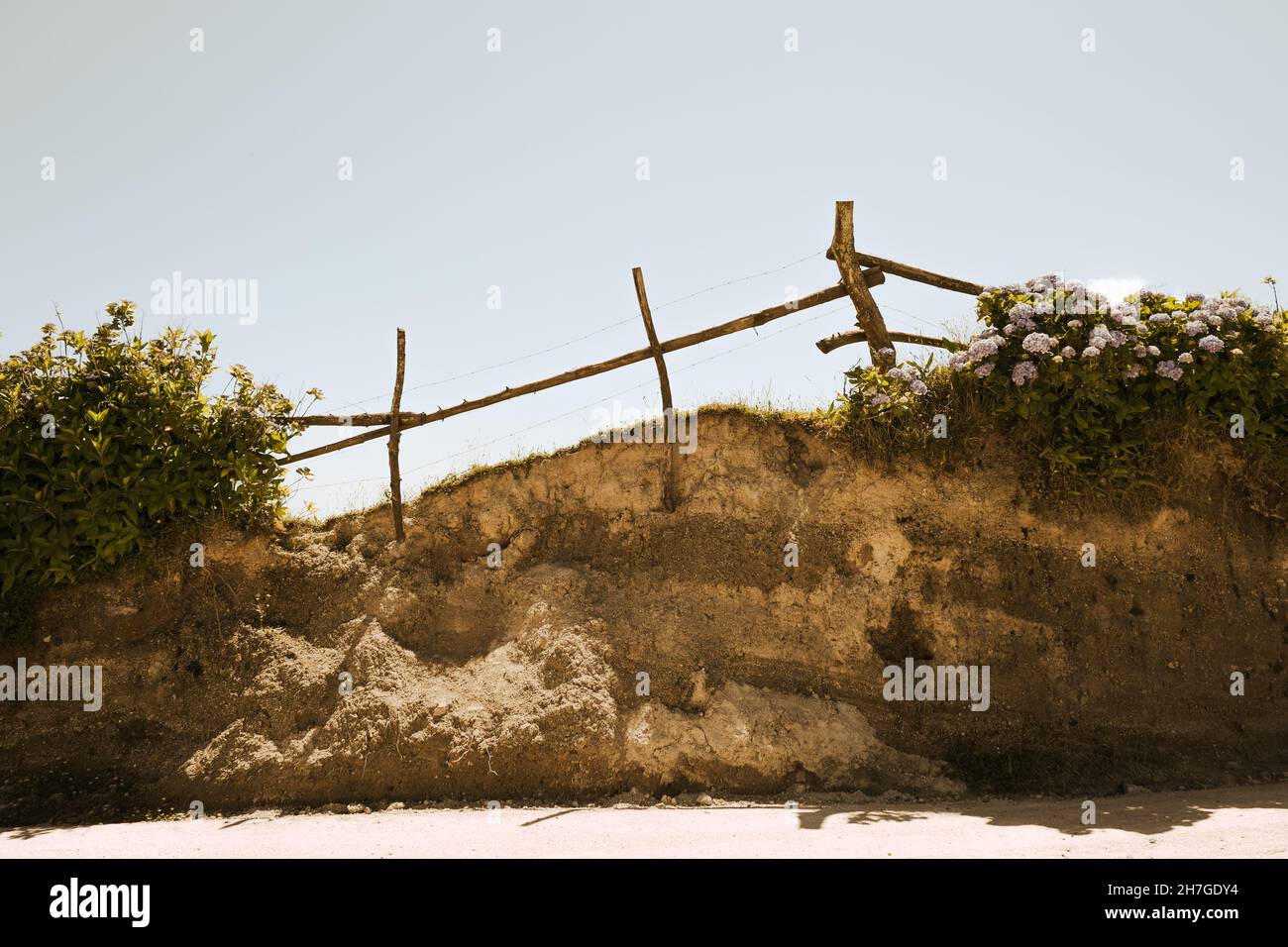 Wooden fence on the small cliff Stock Photo - Alamy