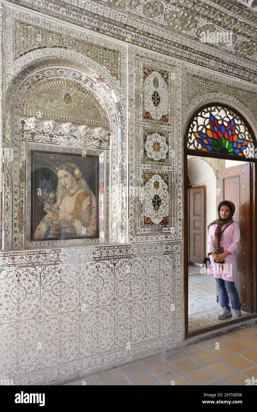 IRAN. SHIRAZ. VISITOR IN THE QAVAM HOUSE, BUILT BETWEEN 1879 AND 1886 ...