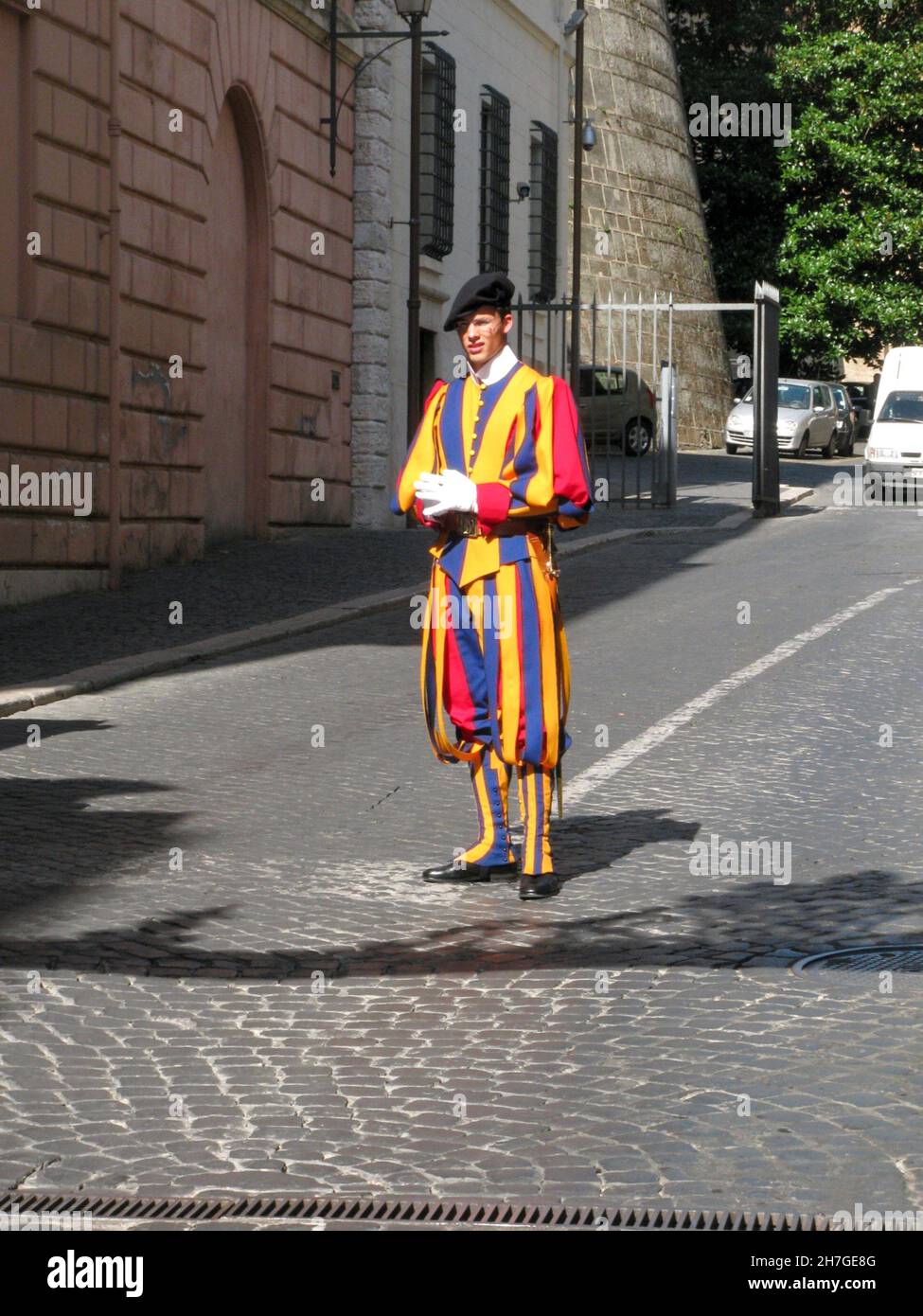 Swiss Guard in traditional uniform at the Vatican city, Rome Italy as ...