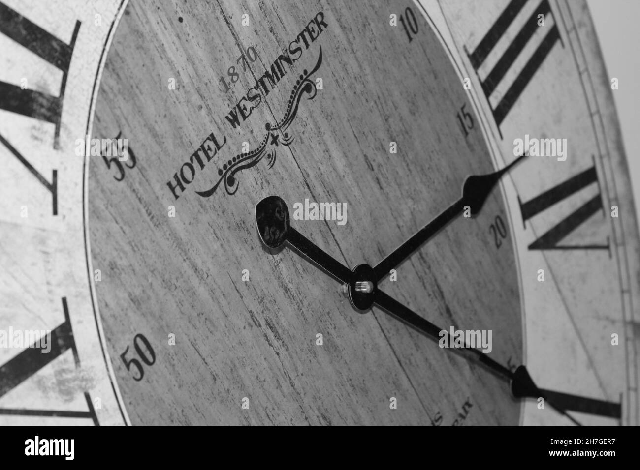 Antique British clock with roman numerals. Clock face says "1870" and ...