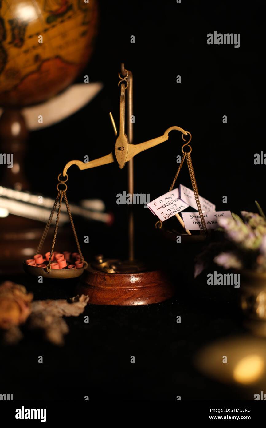 Unbalanced scale in the first term. Flowers, posters, world ball and a ...