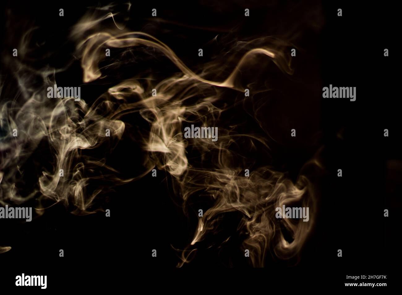 Smoke in natural light. Tobacco smoke fills the air. Clubs of steam in ...