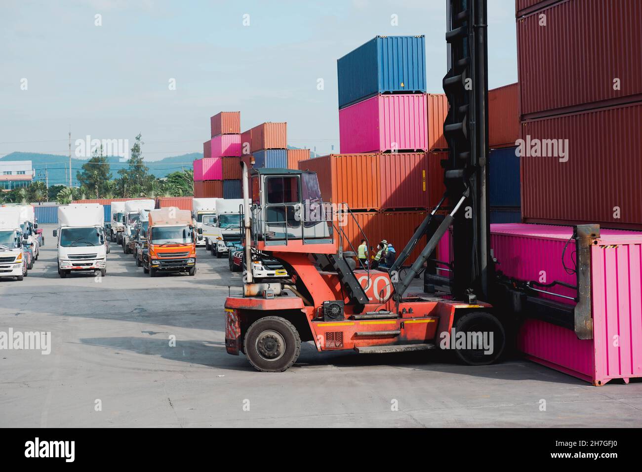 Work in the container yard and the car is lifting. Cargo container in ...