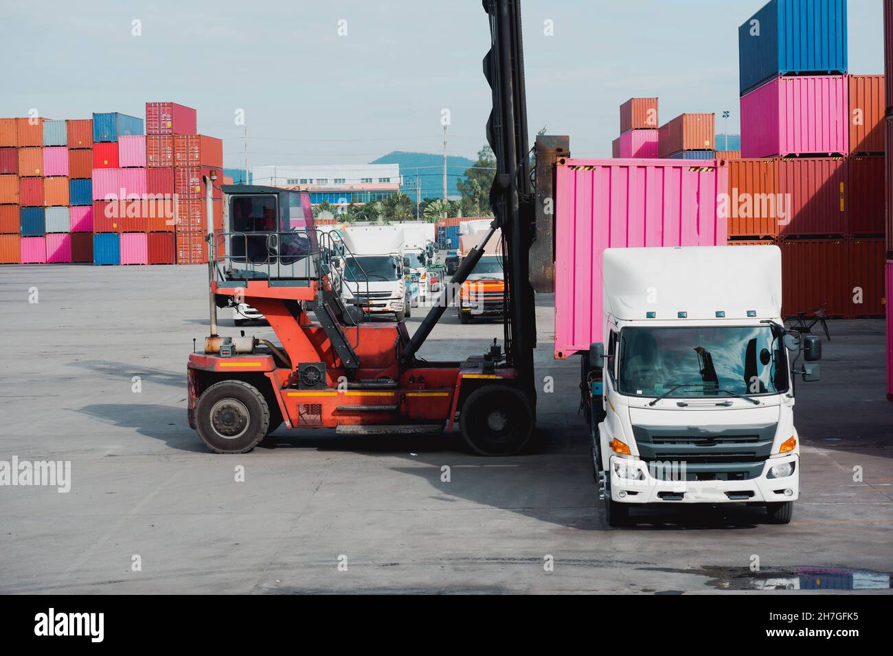 Work in the container yard and the car is lifting. Cargo container in ...