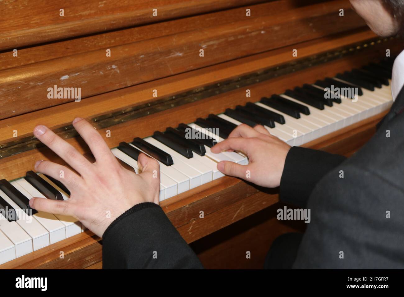 boy playing piano keys Stock Photo - Alamy