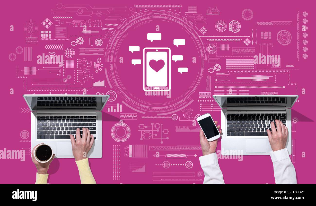 Top view of hands using laptop with symbol of social networking concept ...