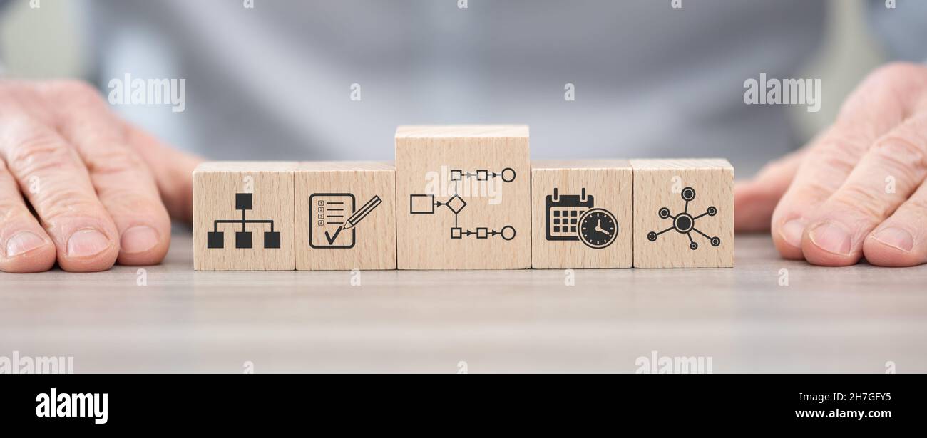 Wooden blocks with symbol of workflow concept Stock Photo - Alamy