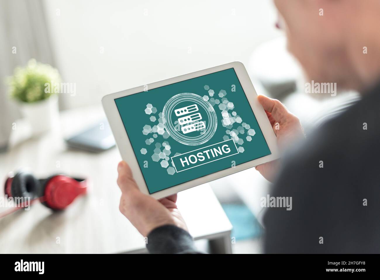 Tablet screen displaying a hosting concept Stock Photo - Alamy