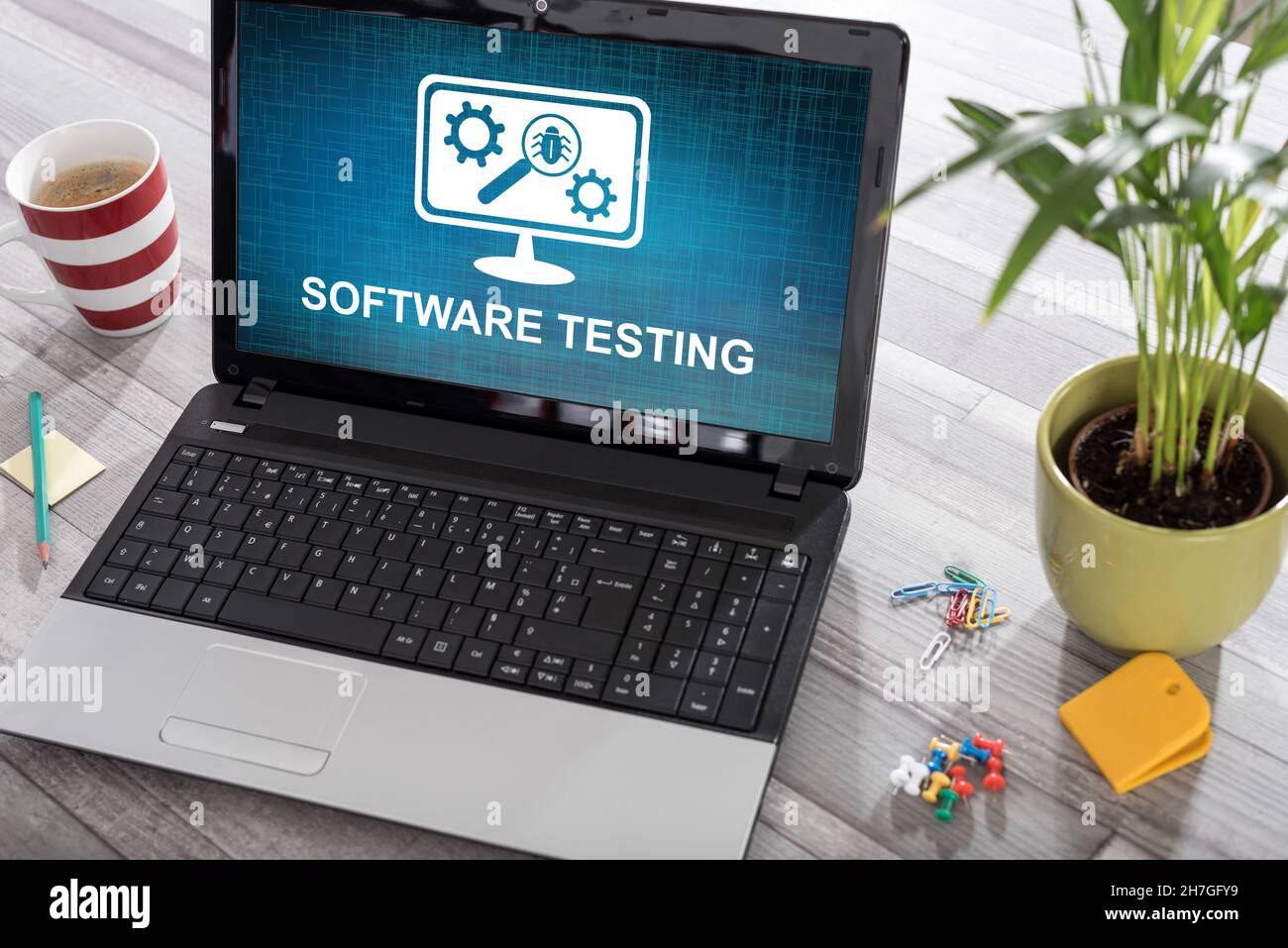 Laptop on a desk with software testing concept on the screen Stock ...