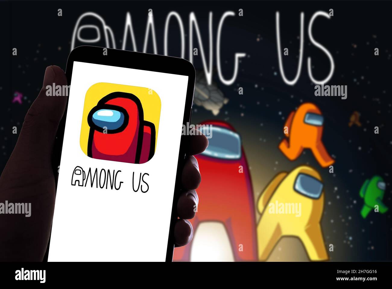 The online videogame Among Us app is seen on the screen of a mobile ...