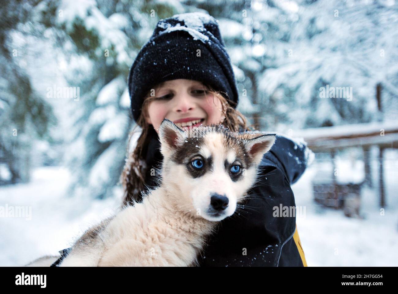 SCANDINAVIA. FINLAND IN WINTER. HOSSA NATIONAL PARK. YOUNG GIRL WITH A ...