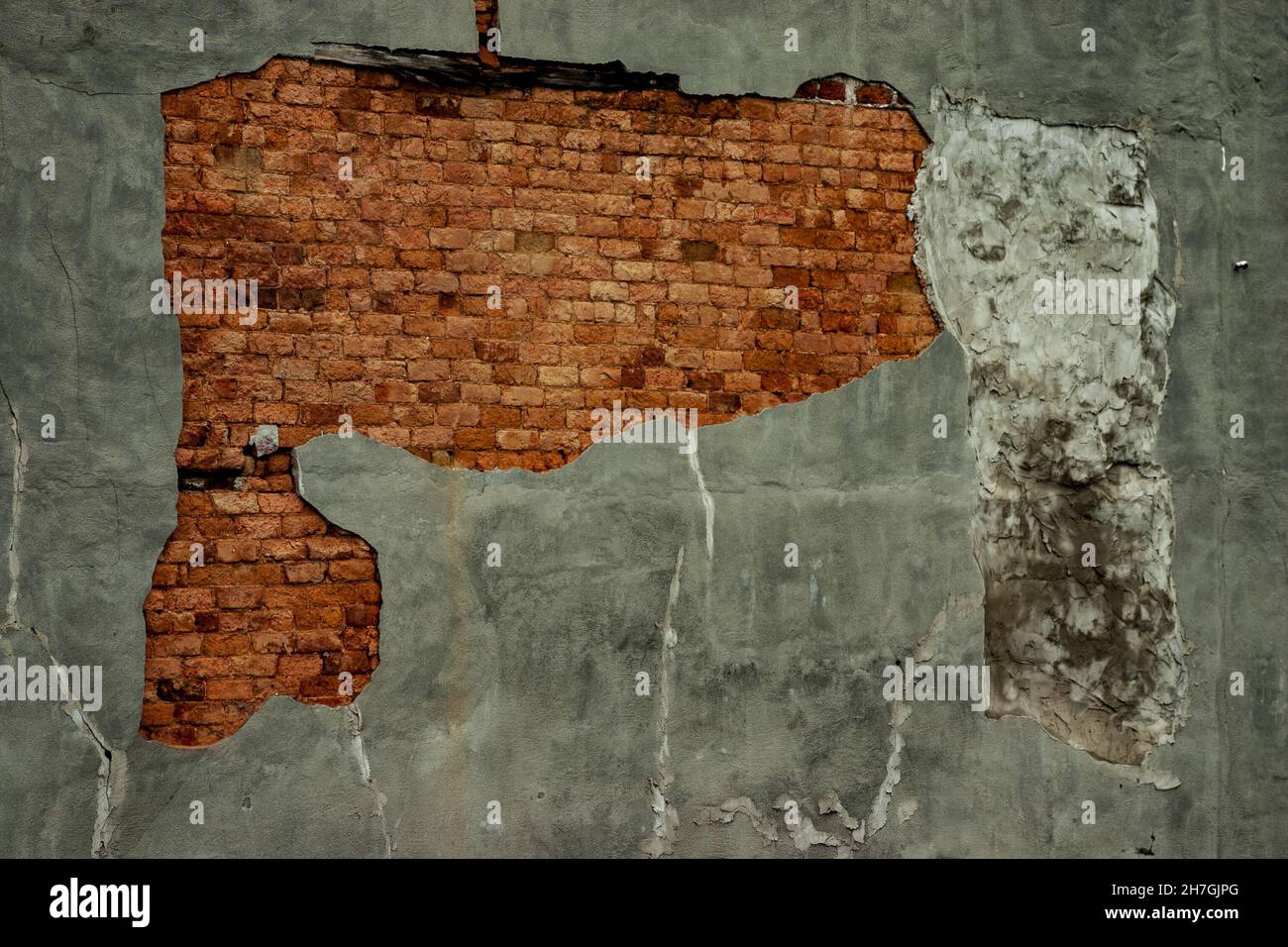 Weathered adobe wall with aging bricks showing through Stock Photo - Alamy