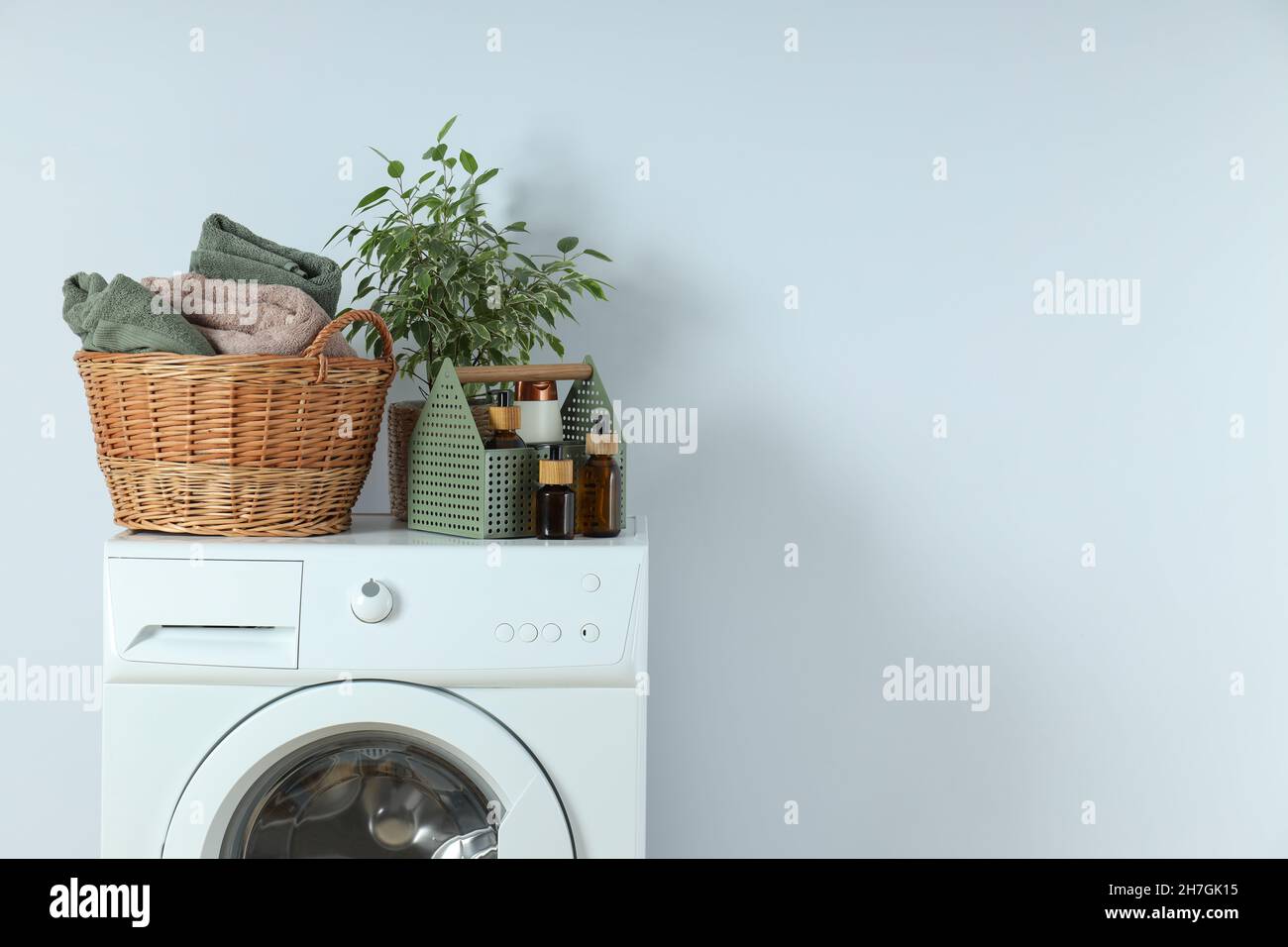 Concept of housework with washing machine on white background Stock ...