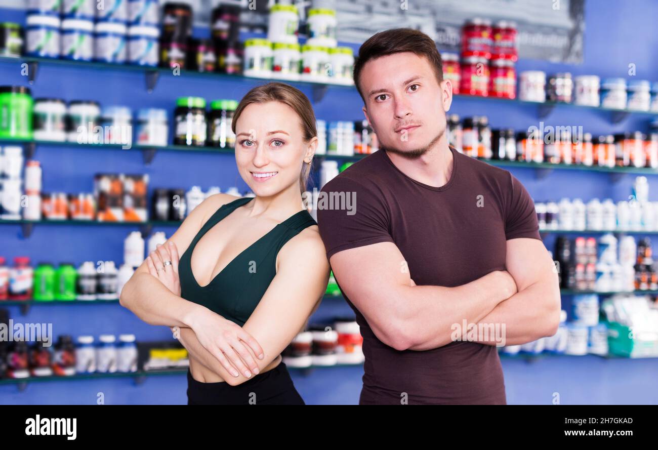 muscular people standing with crossed arms Stock Photo - Alamy