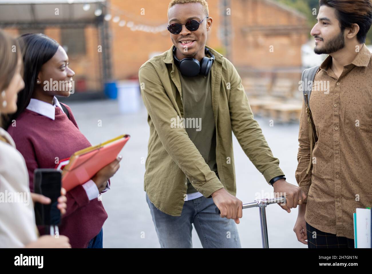 Students walk together at university campus Stock Photo - Alamy