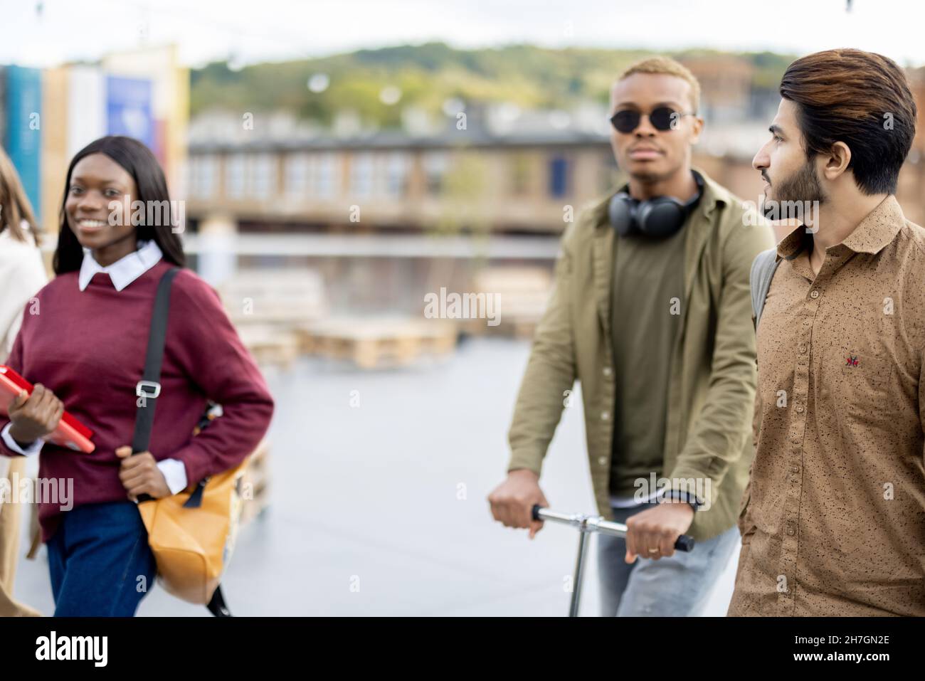 Students walk together at university campus Stock Photo - Alamy