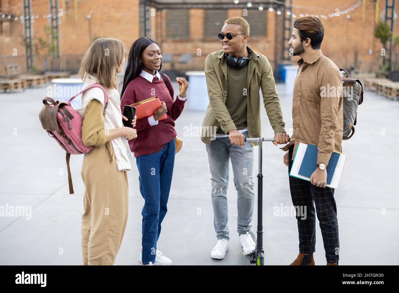Students walk together at university campus Stock Photo - Alamy