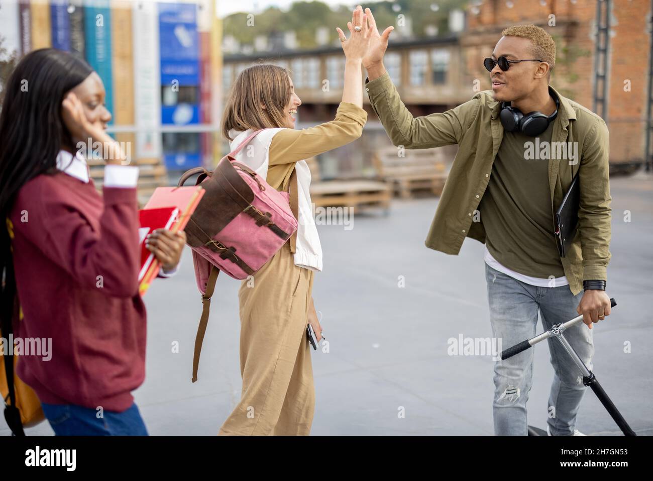Students meeting on area of university campus Stock Photo - Alamy
