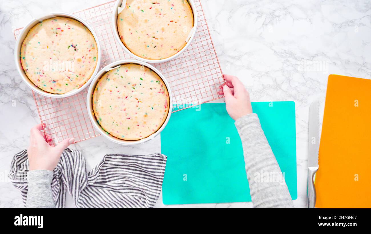 Flat lay. Step by step. Cooling freshly baked funfetti cake layers on a ...