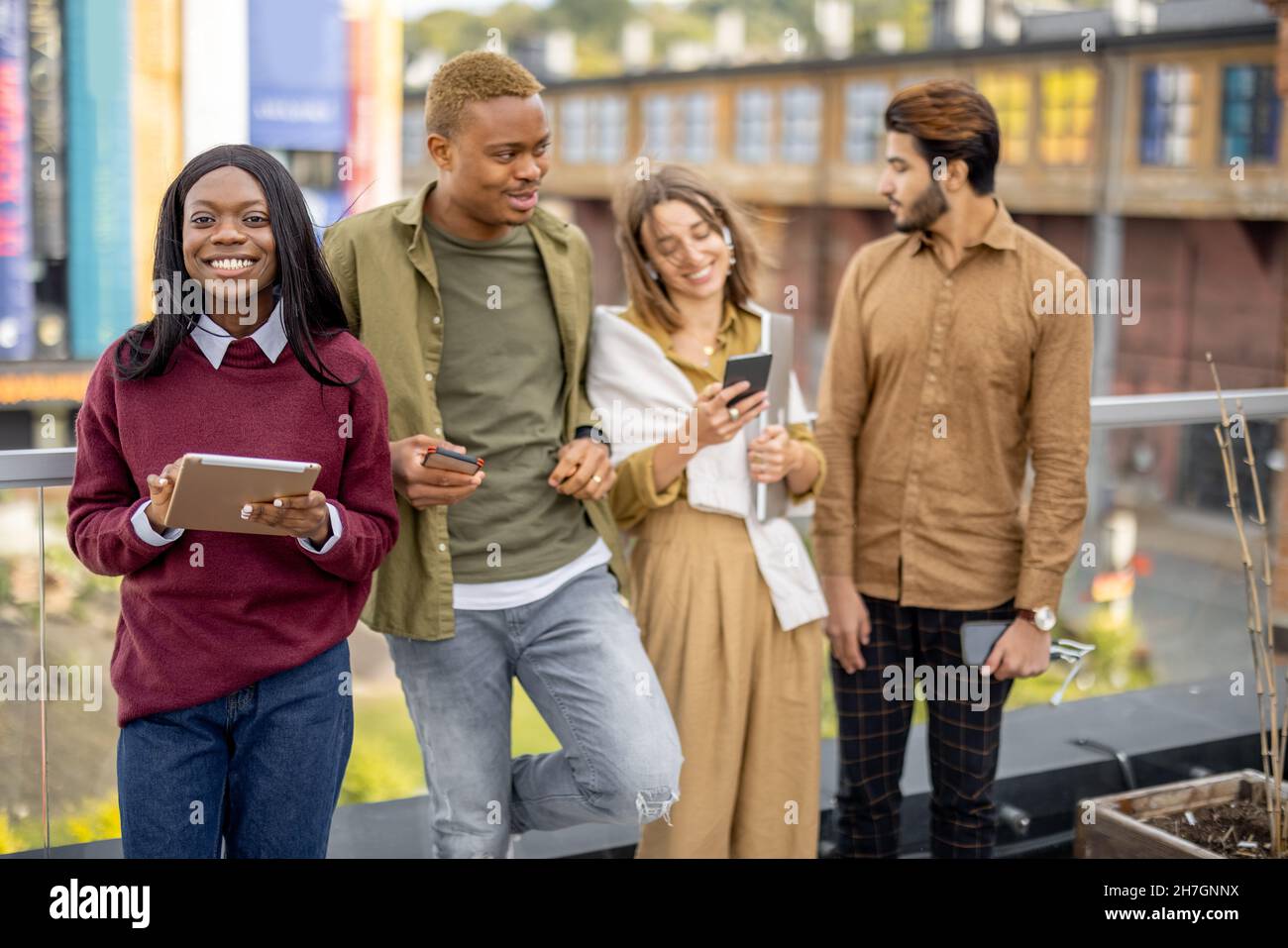 Students use digital devices at university campus Stock Photo - Alamy