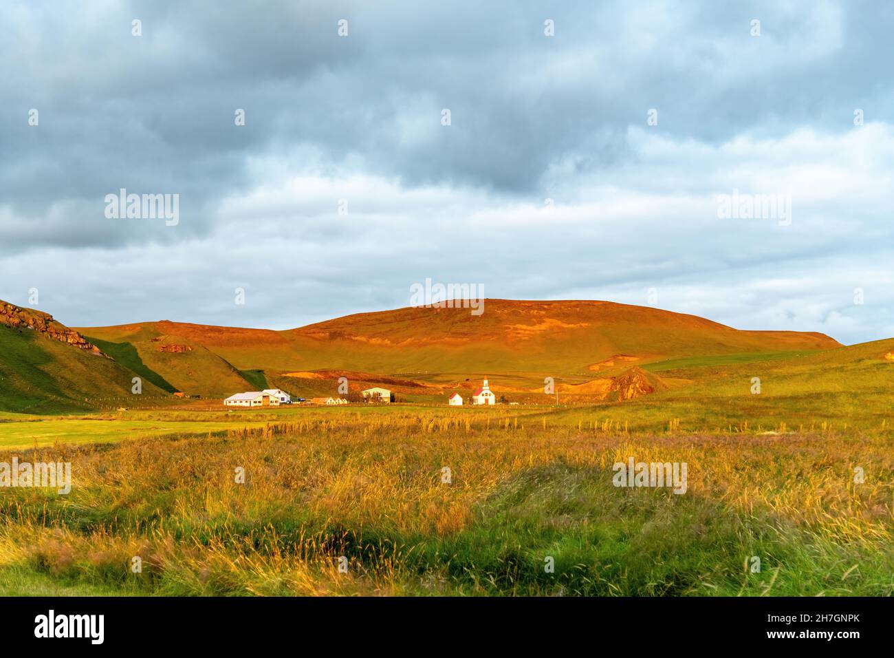 Panoramic view of a small farm with farm house, barns and small church ...