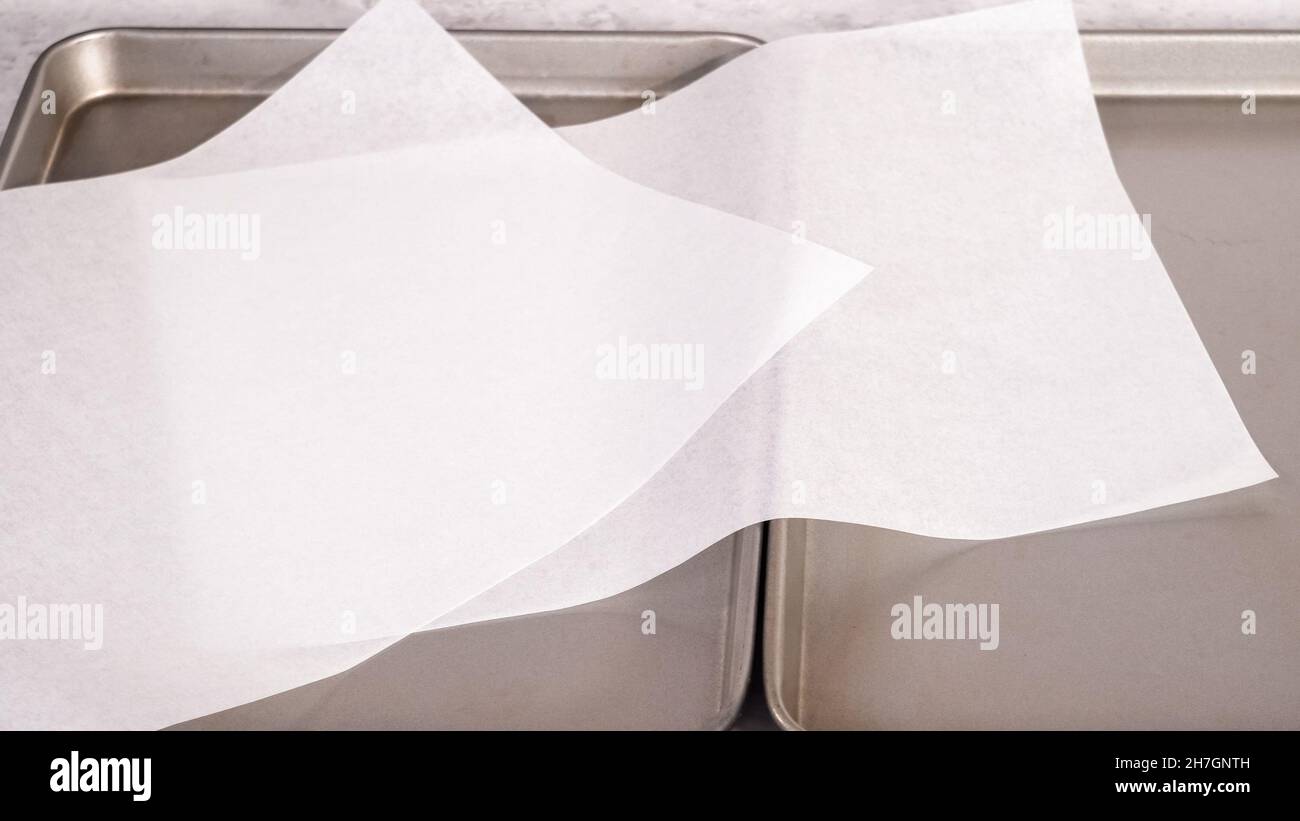 Step by step. Empty baking sheets with a white parchment paper Stock ...