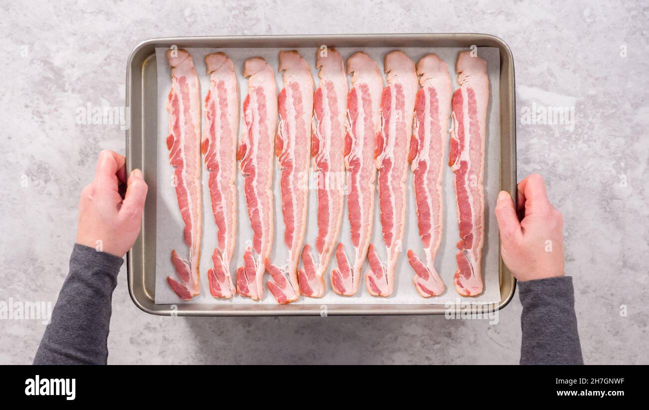Flat lay. Step by step. Uncooked bacon strips on a baking sheet with ...