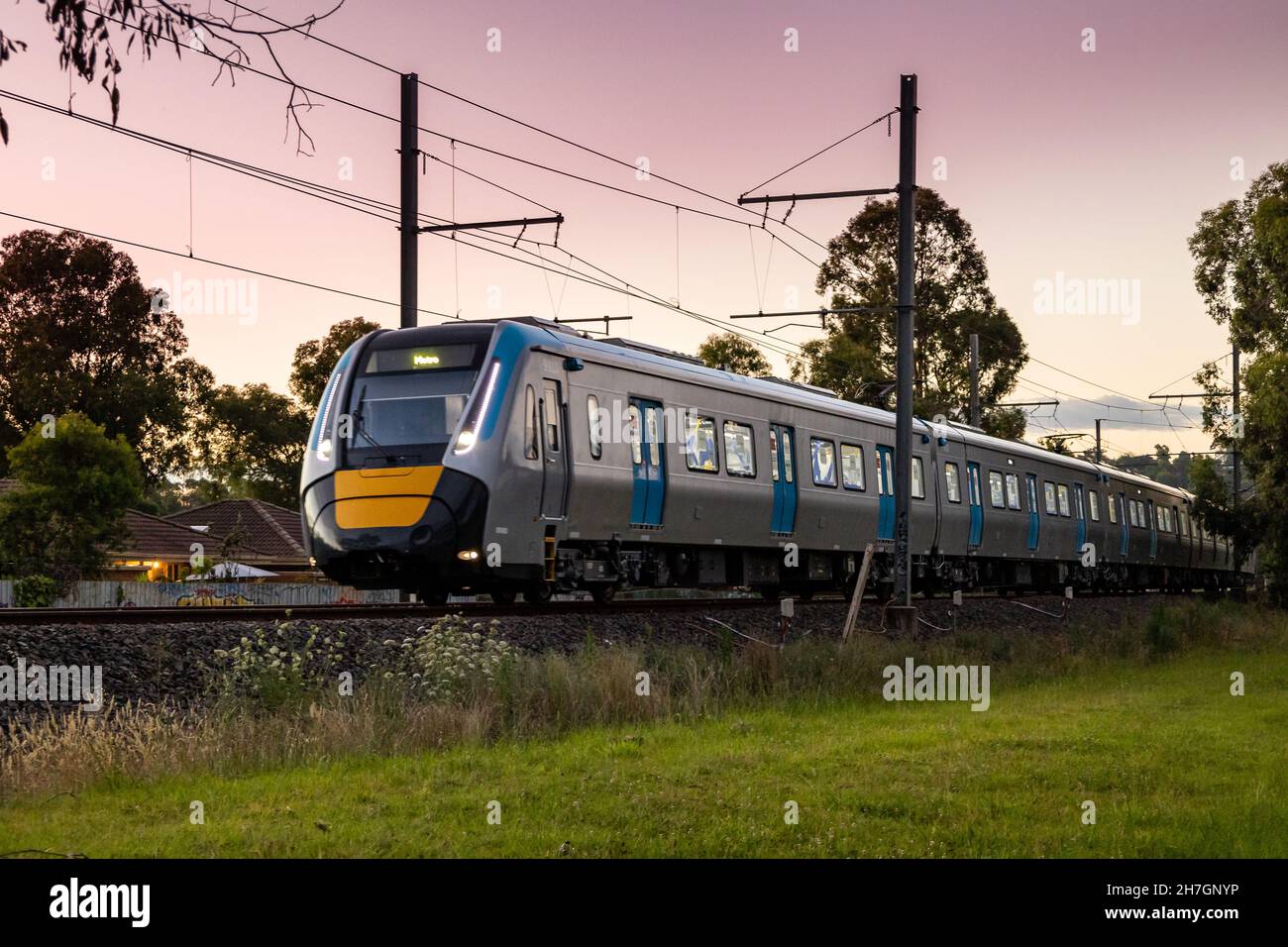 MELBOURNE, AUSTRALIA - Jan 21, 2021: A high capacity train at sunset in ...