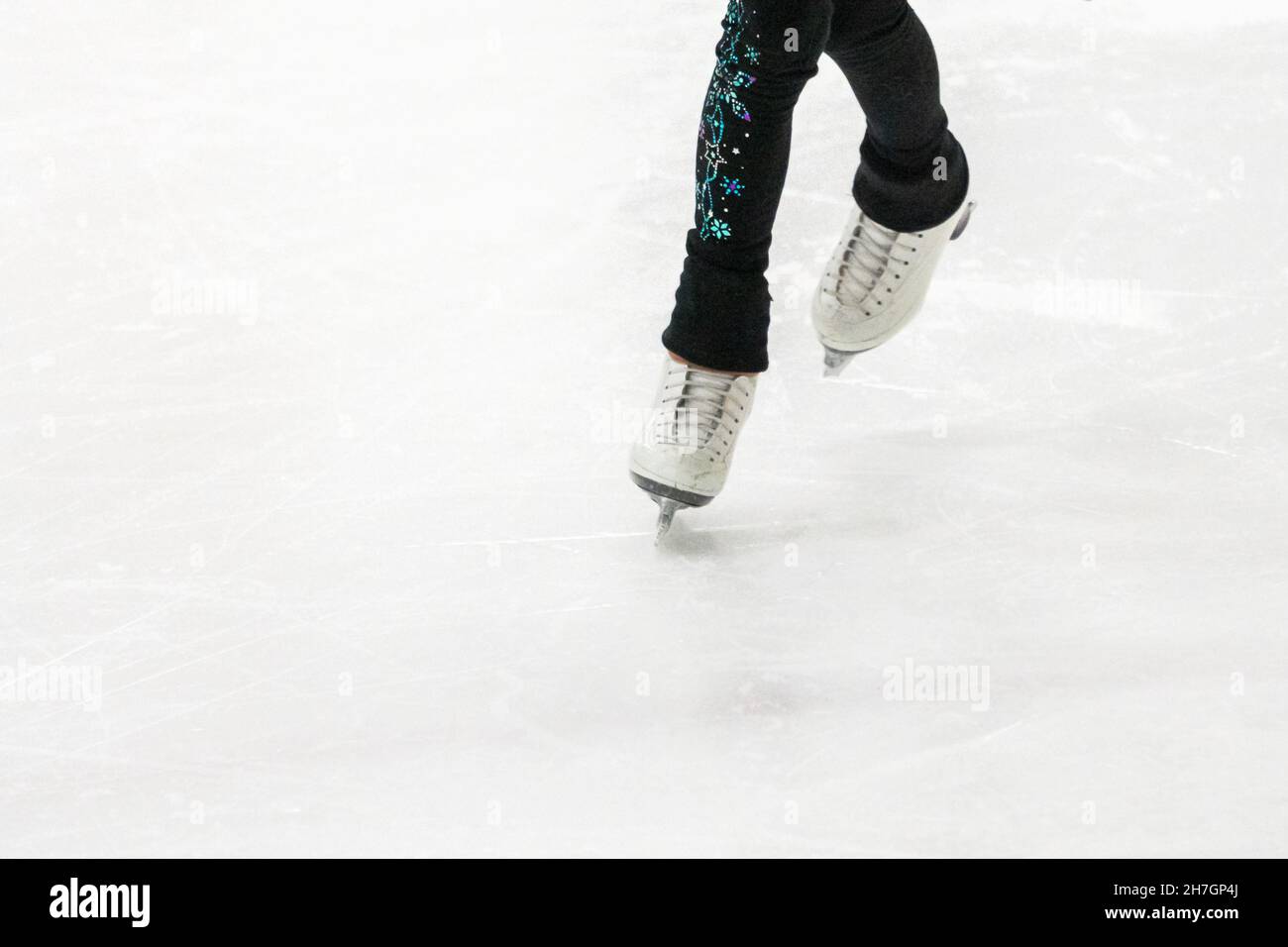 View of figure skater feet at the figure skating practice Stock Photo ...