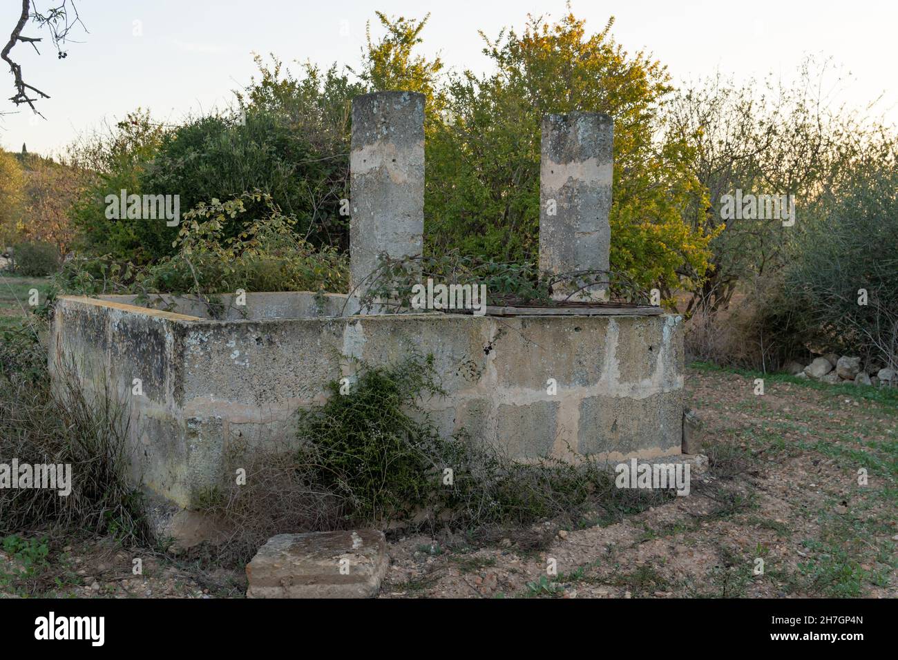 Old abandoned well, made of mares stone, in the interior of the island ...