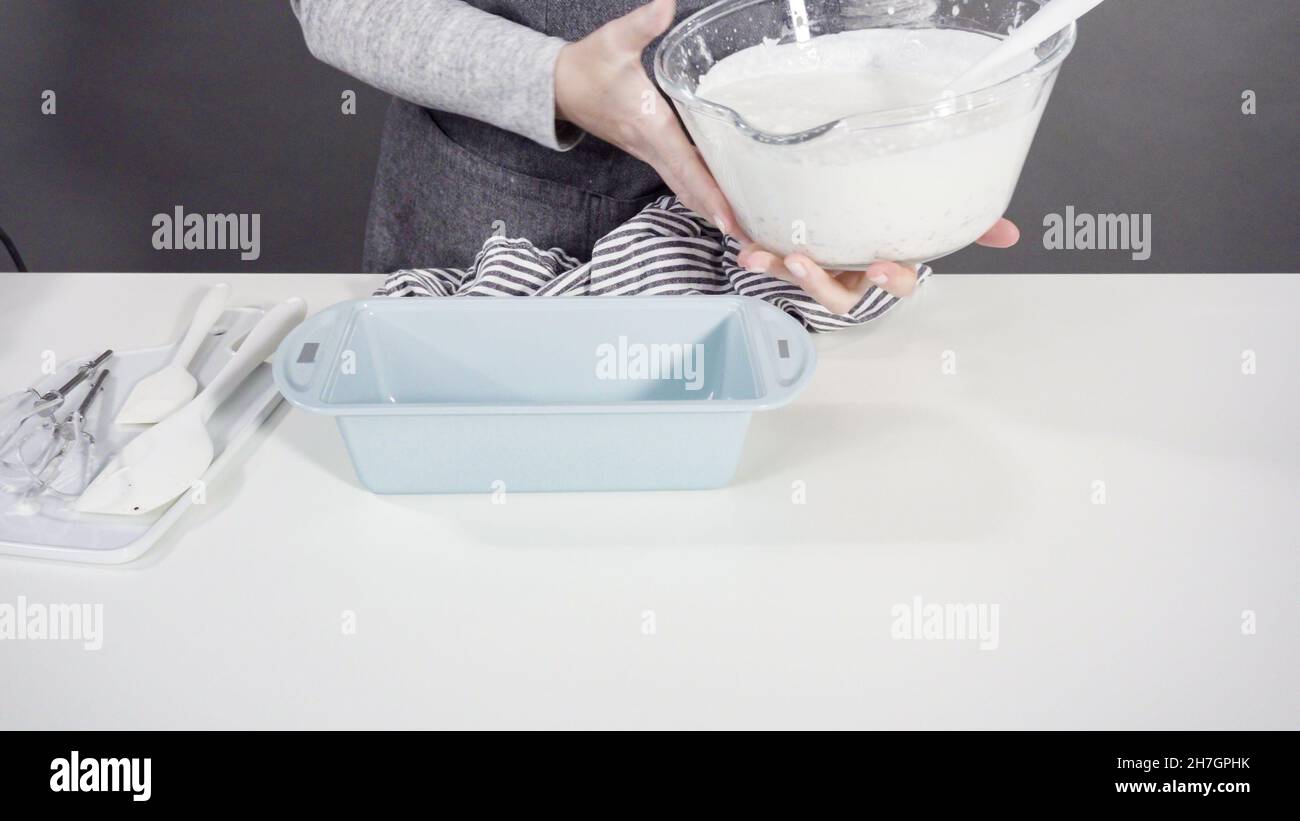 Pouring ice cream mixture into the baking pan to be frozen Stock Photo ...