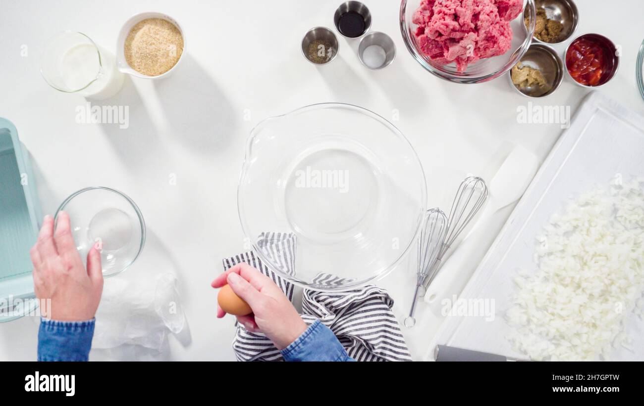 Flat lay. Step by step. Mixing ingredients for a classic beef meatloaf ...