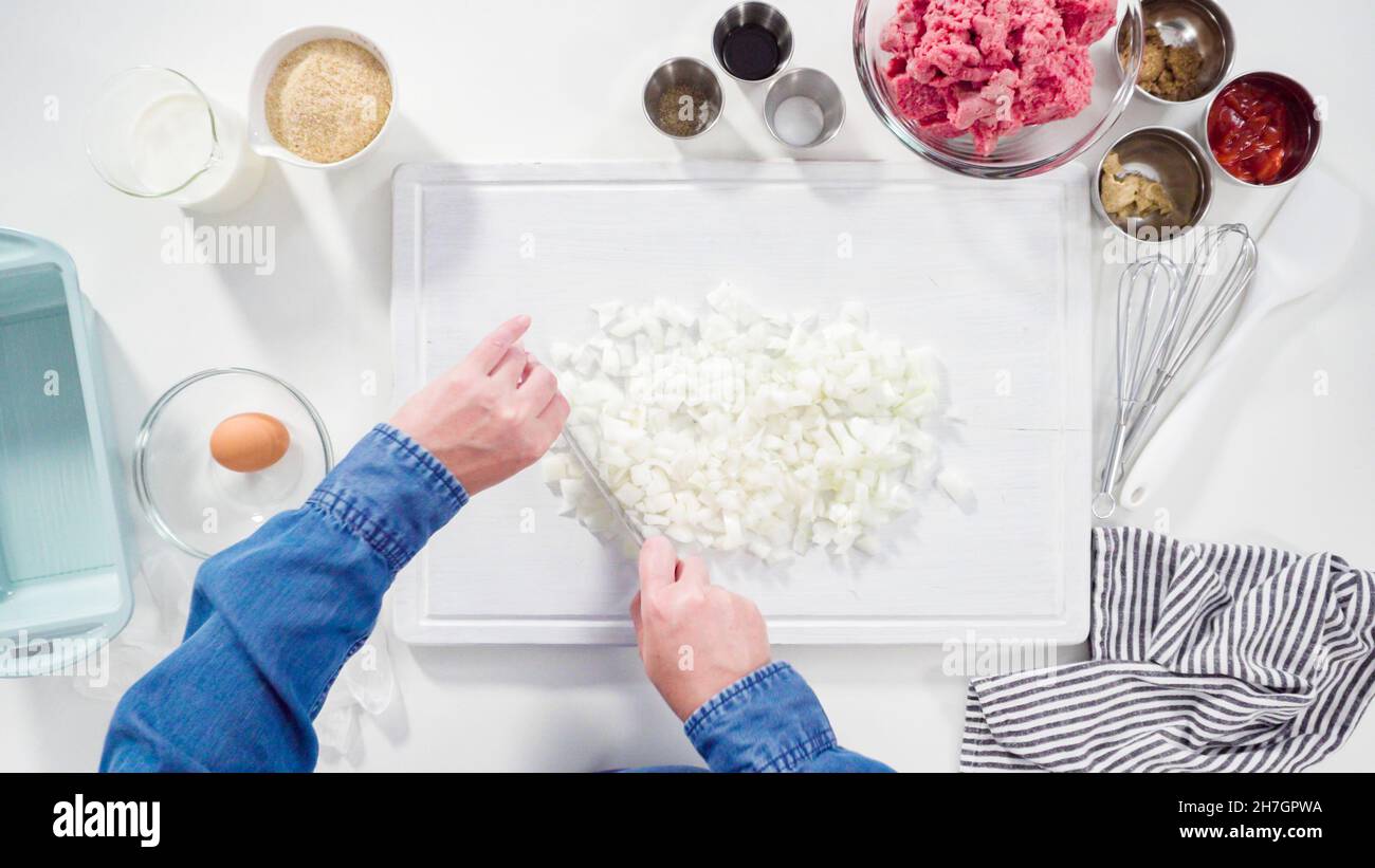 Flat lay. Step by step. Mixing ingredients for a classic beef meatloaf ...
