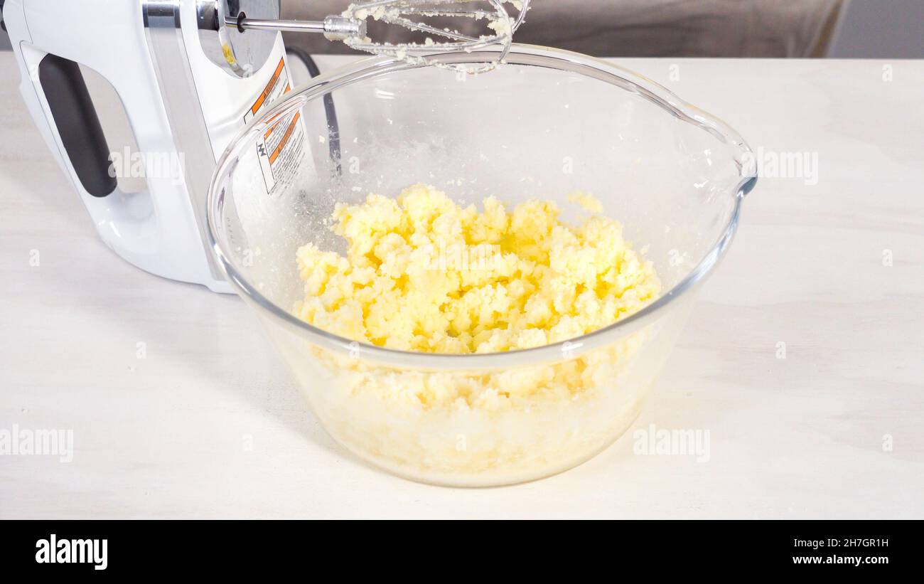 Step by step. Mixing ingredients in a glass mixing bowl to bake ...