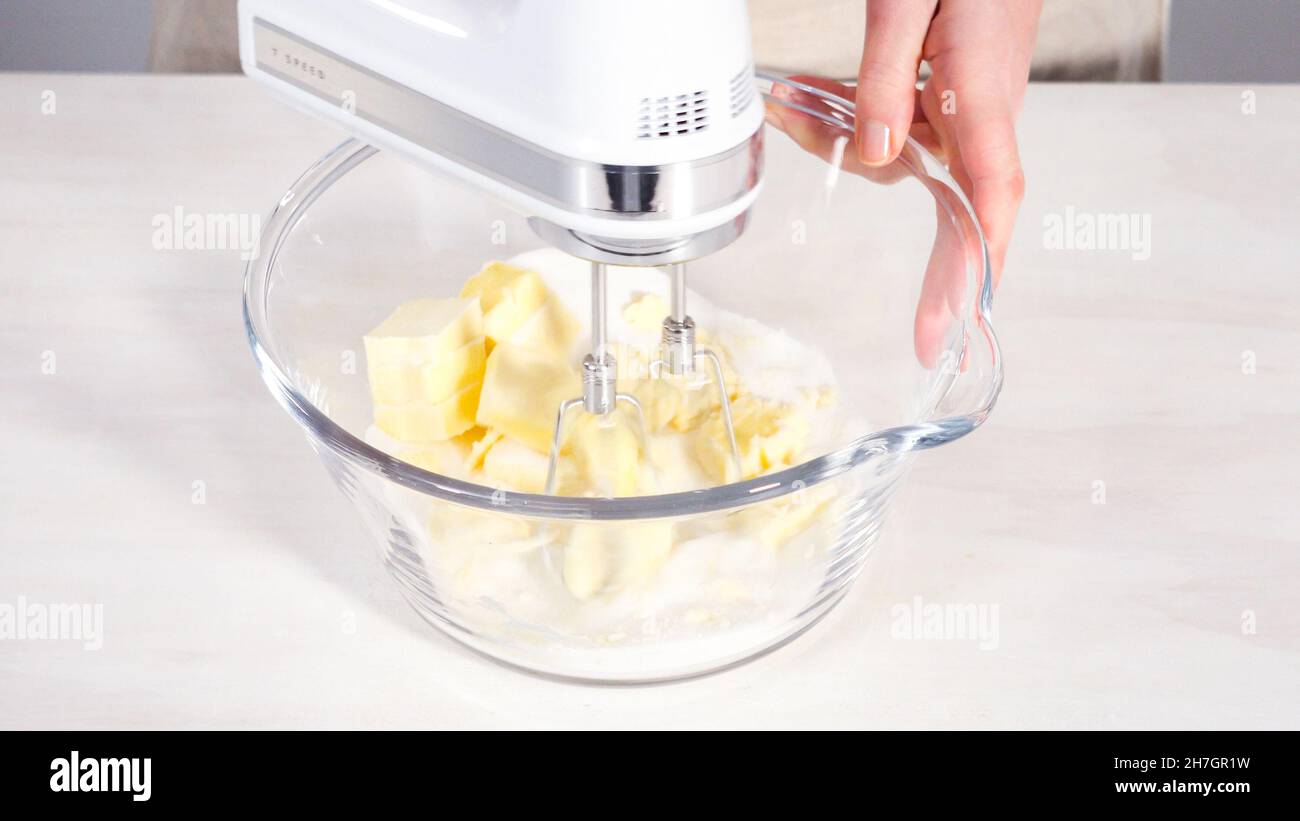 Step by step. Mixing ingredients in a glass mixing bowl to bake ...