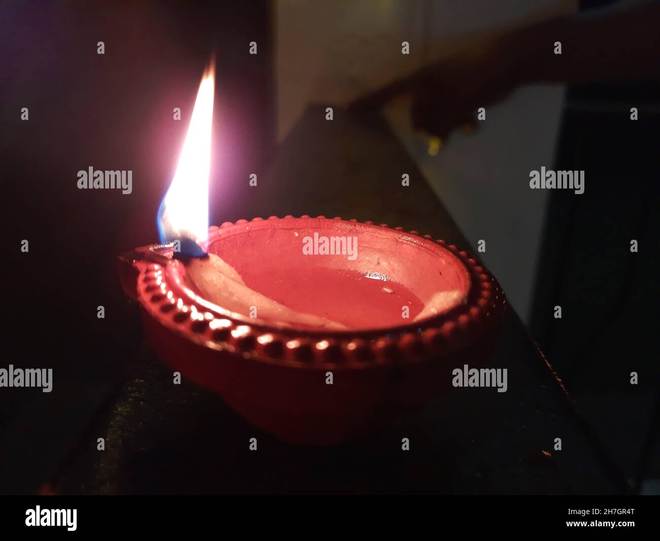 Traditional clay Diya lamps lit during Diwali celebration Stock Photo ...