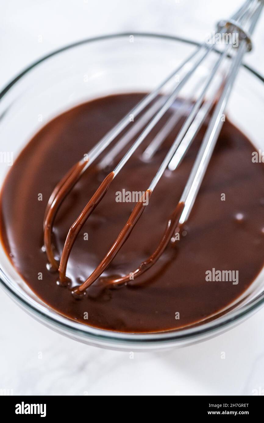 Preparing chocolate ganache in a glass mixing bowl Stock Photo - Alamy