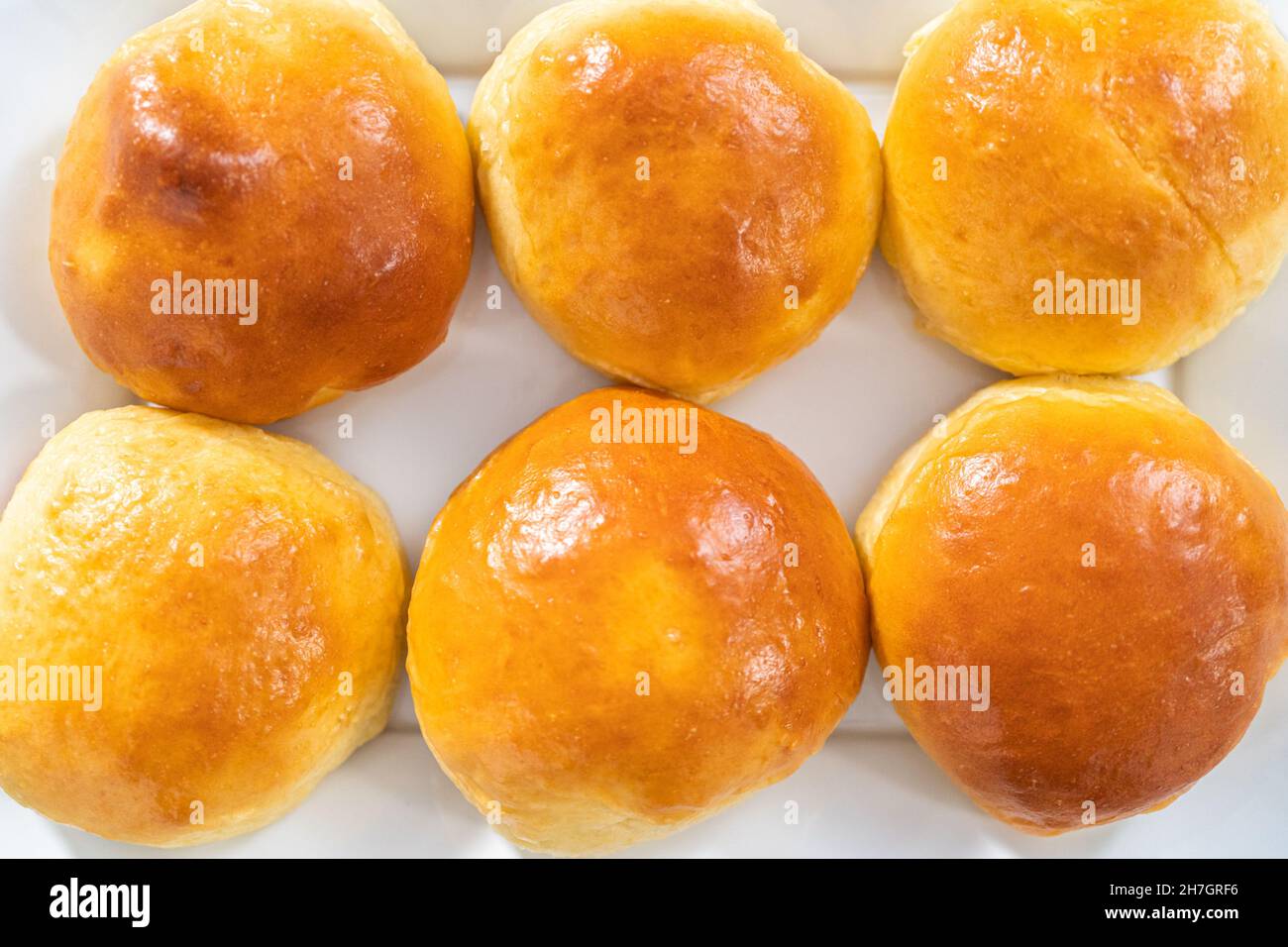 Freshly baked brioche buns on a metal serving tray Stock Photo - Alamy
