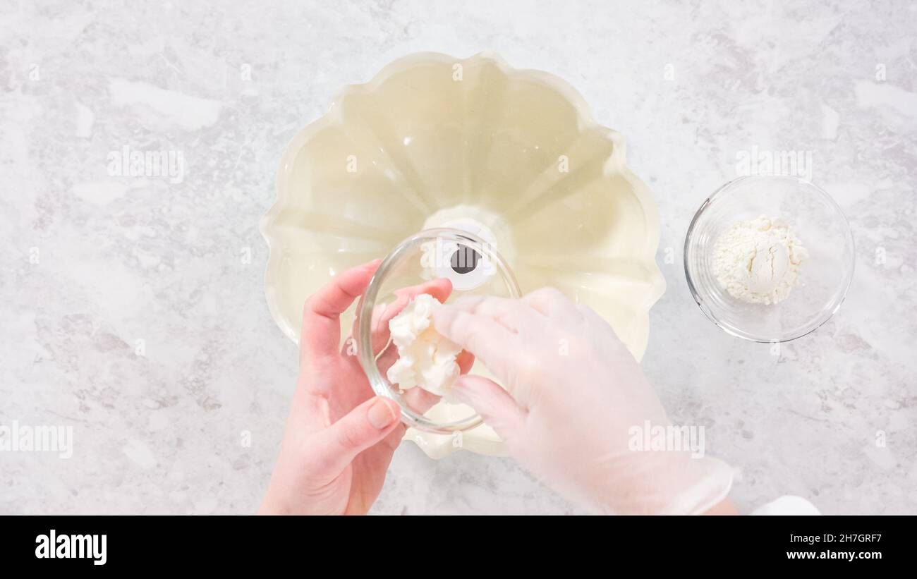 Flat lay. Step by step. Greasing bundt cake pan with vegetable ...