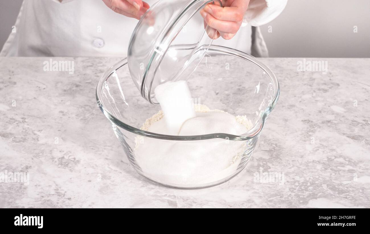 Step by step. Mixing ingredients in a glass mixing bowl to bake ...