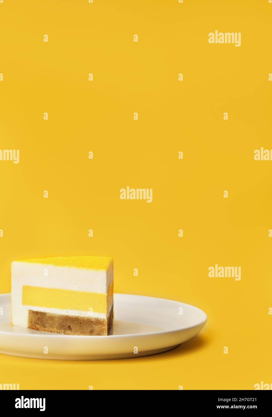 Delicious mango and passion fruit mousse cake slice with the layers and ...