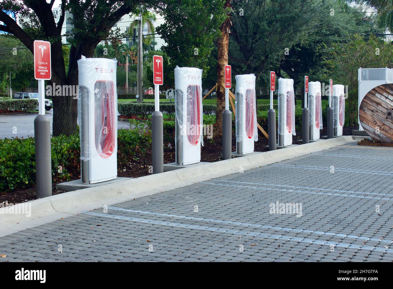New Tesla EV chargers retrofit into parking lot Stock Photo - Alamy