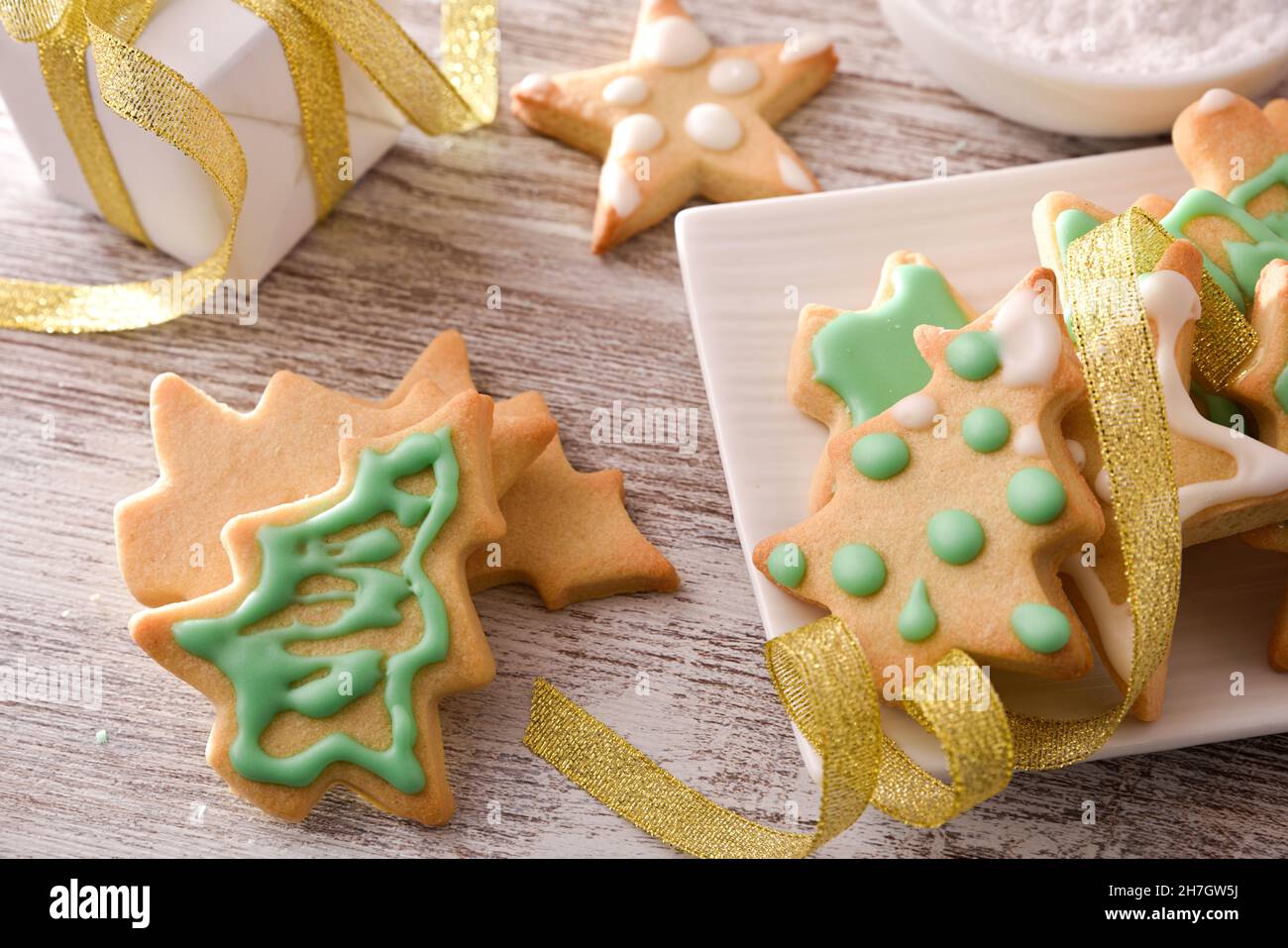 Wooden table with cookies with freshly prepared Christmas shapes on ...