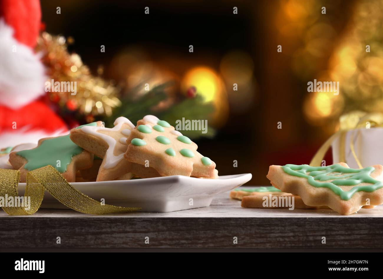 Wooden table with cookies with freshly prepared Christmas shapes on ...