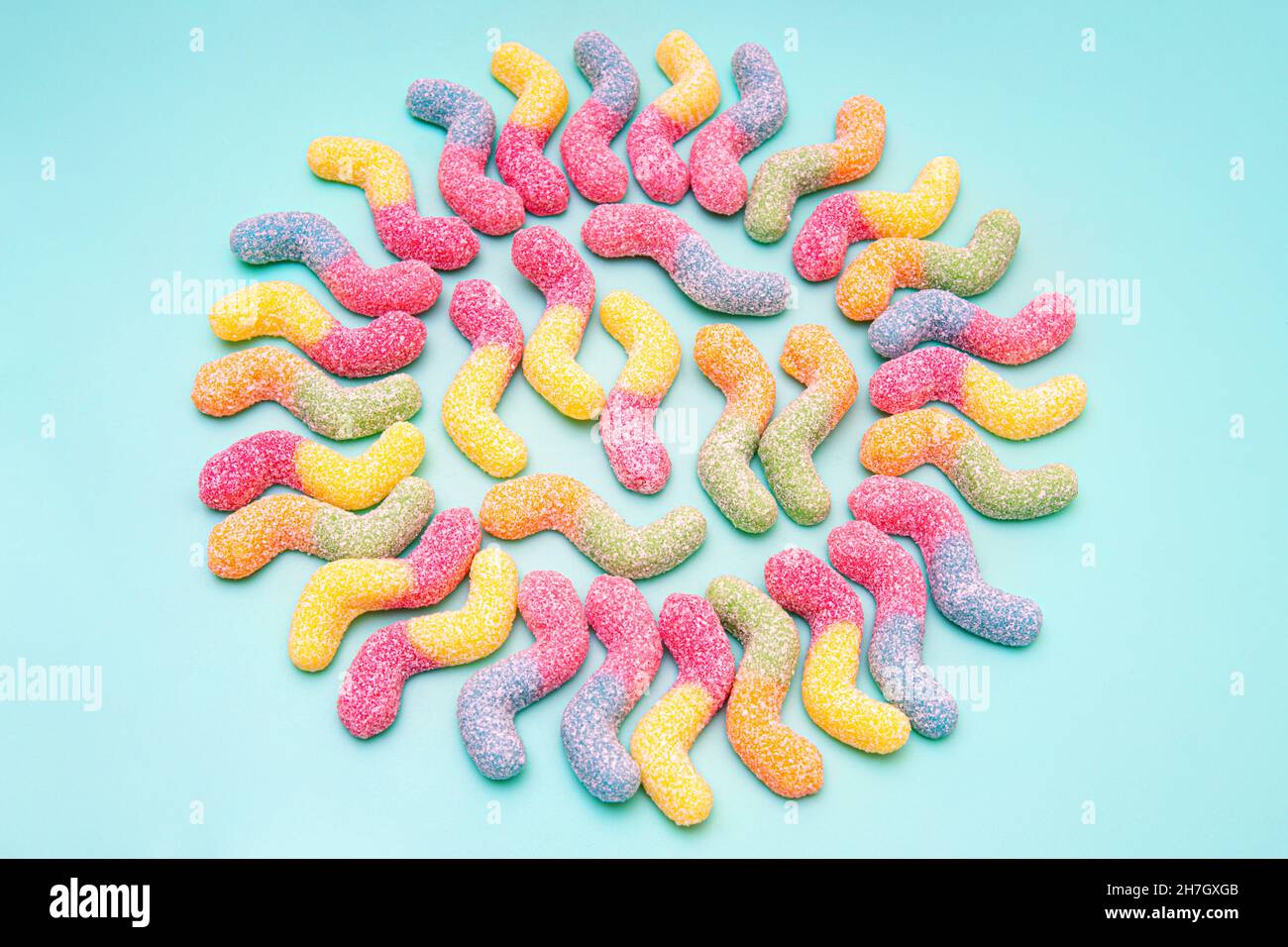 Sun shape made of gummy candies isolated on blue background Stock Photo ...