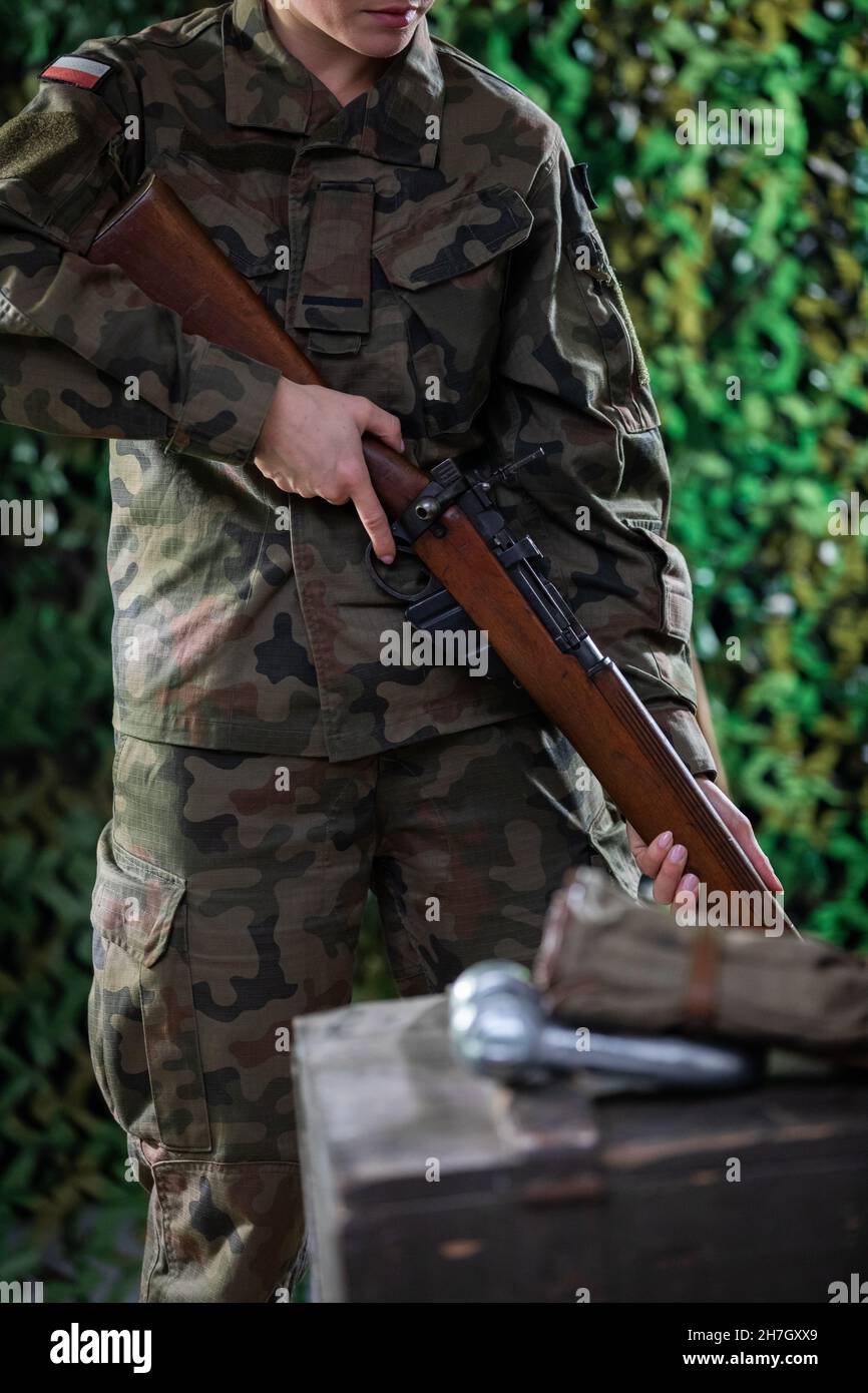 A lady soldier inspects a newly received self-reloading rifle Stock ...