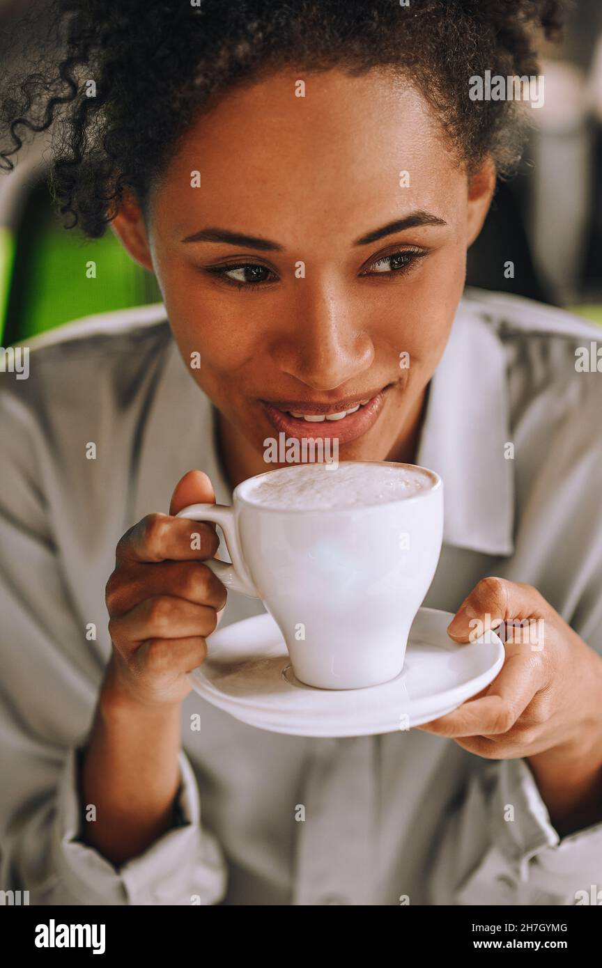 Curly african american woman having hi-res stock photography and images ...